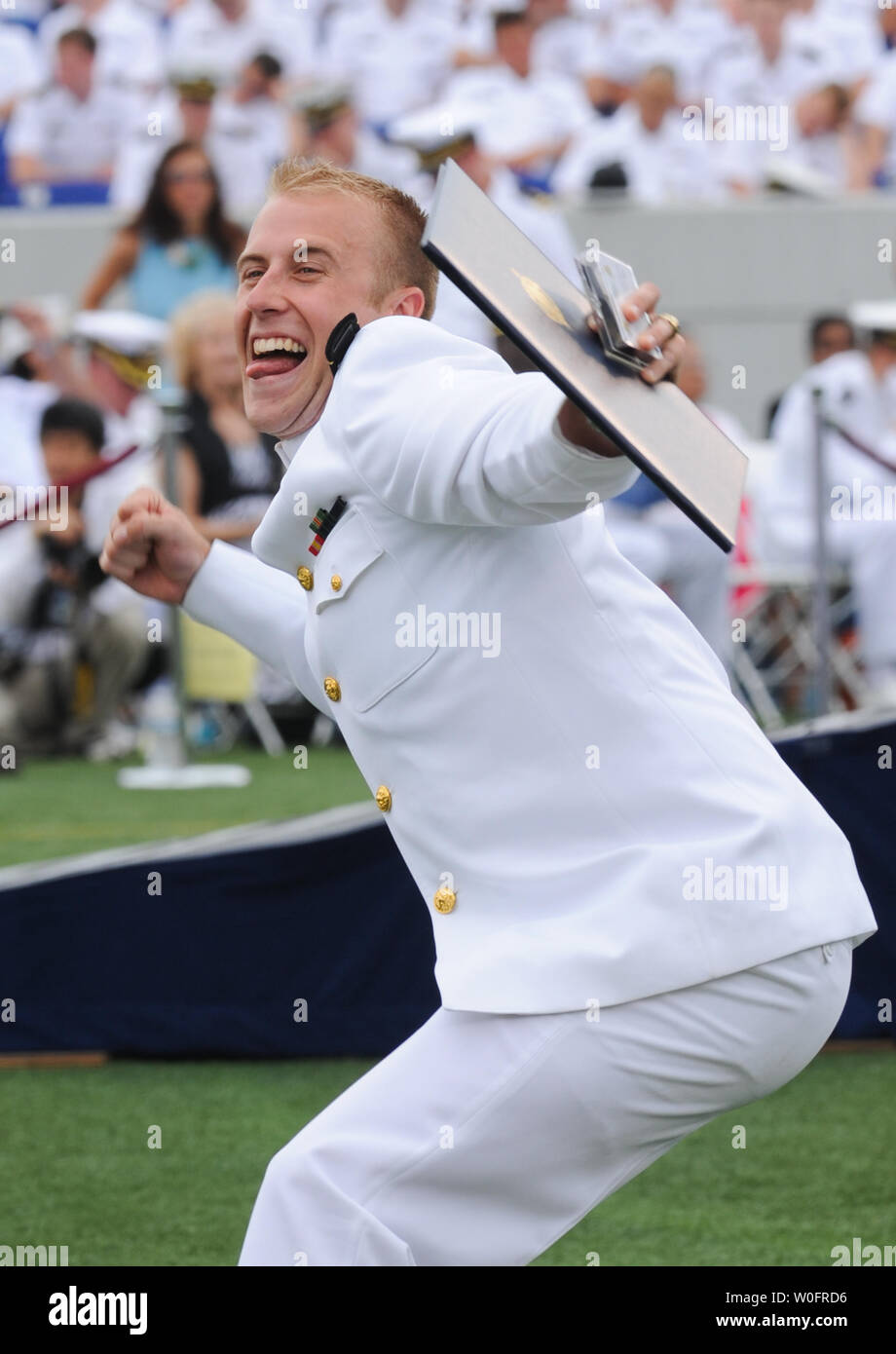 A Navy midshipmen celebrates after receiving his diploma at the U.S ...