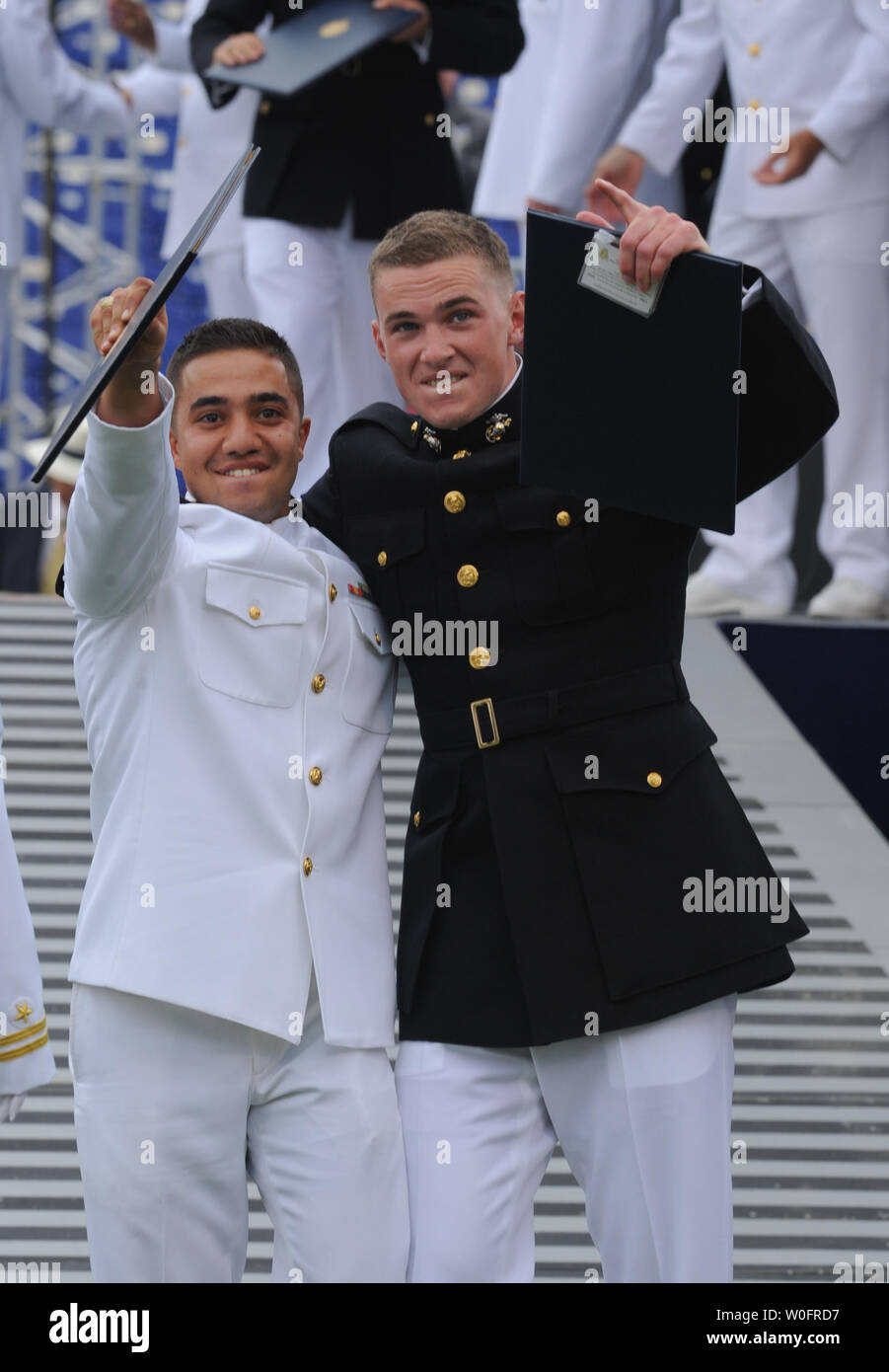 Graduates celebrate after receiving their diploma at the U.S. Naval ...