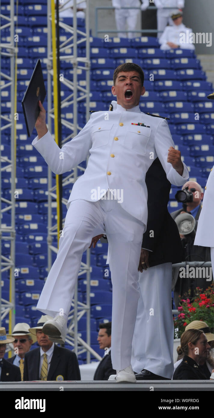 A Navy midshipmen celebrates after receiving his diploma at the U.S ...