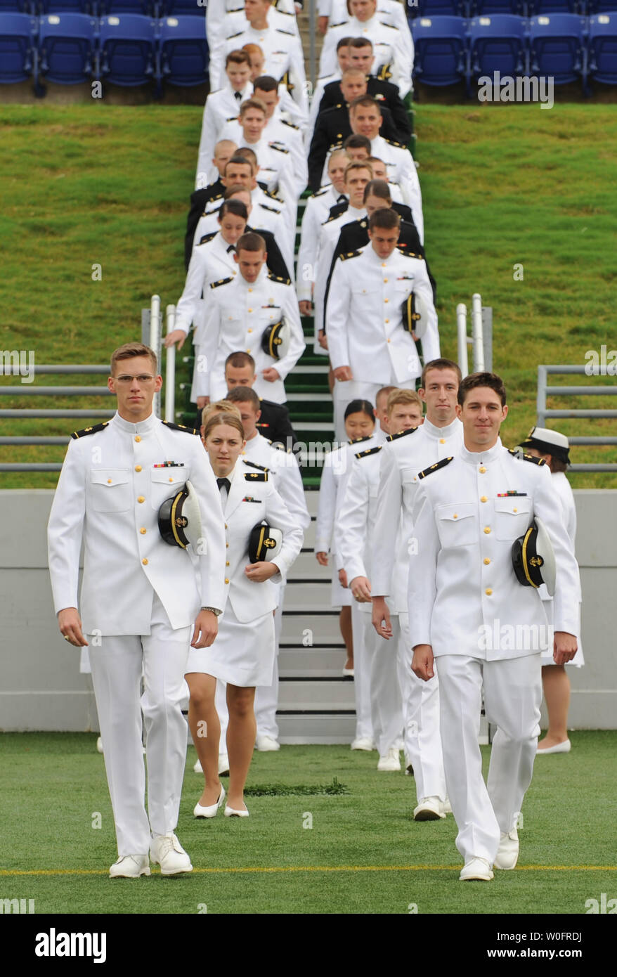 Navy midshipmen walk in procession entering the U.S. Naval Academy ...