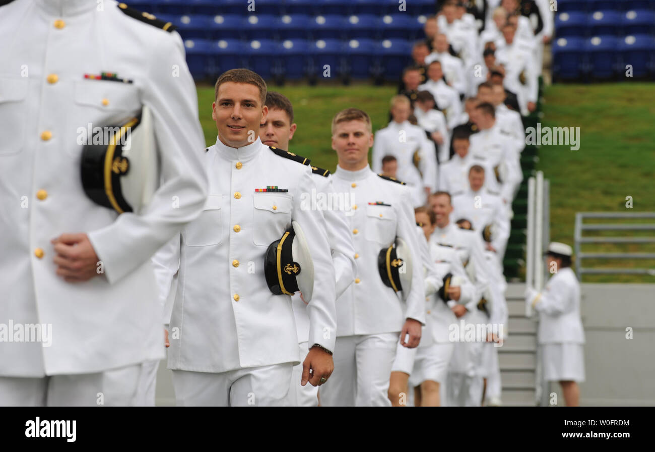 Navy midshipmen walk in procession entering the U.S. Naval Academy ...
