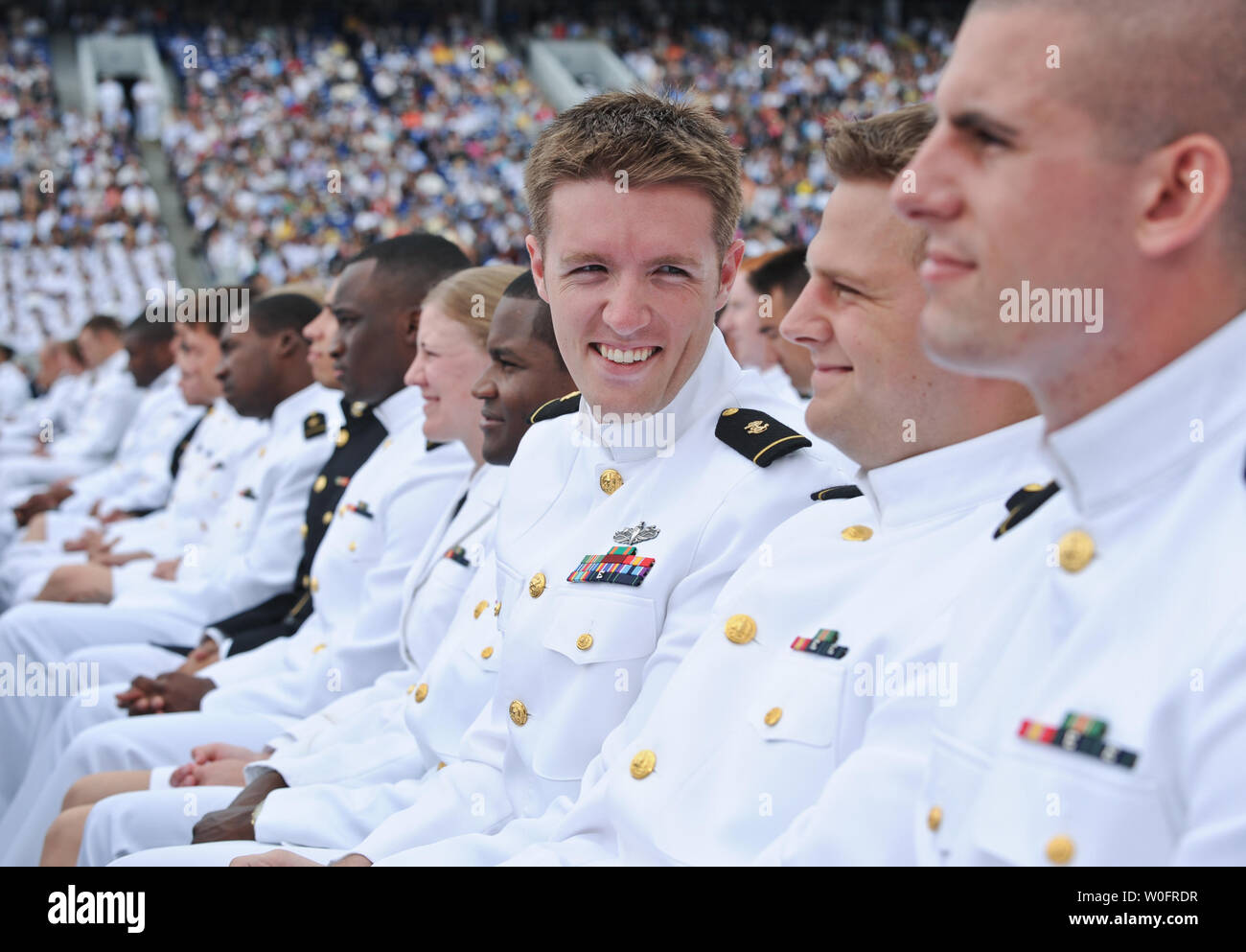 Navy midshipmen smile during the U.S. Naval Academy Graduation and ...