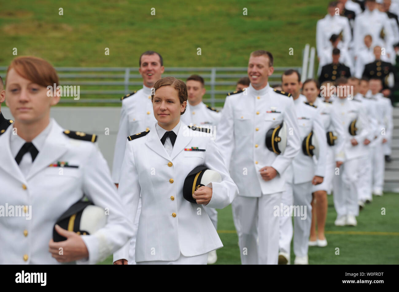 Navy midshipmen walk in procession entering the U.S. Naval Academy ...
