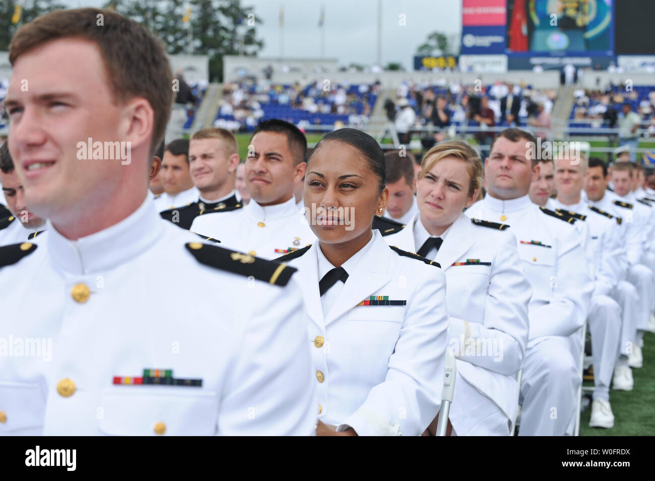 Navy midshipmen listen during the U.S. Naval Academy Graduation and ...