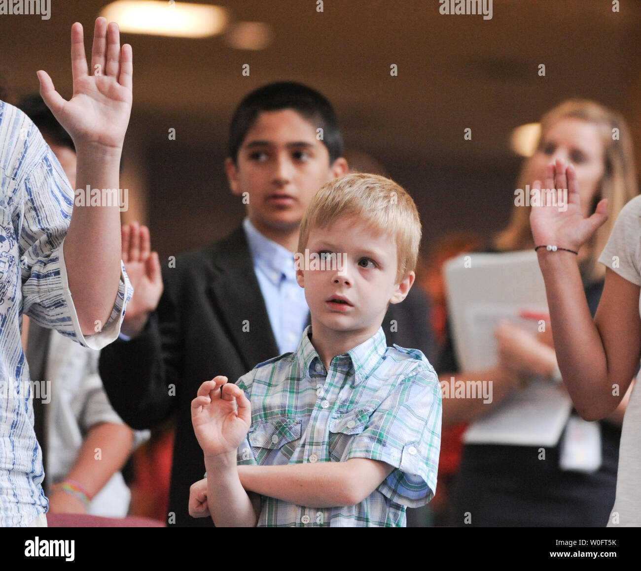 24 children representing 18 countries take the Oath of Allegiance at a ...