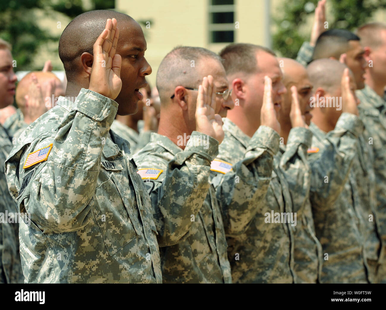 U.S. Army soldiers are sworn in during a re-enlistment ceremony during ...