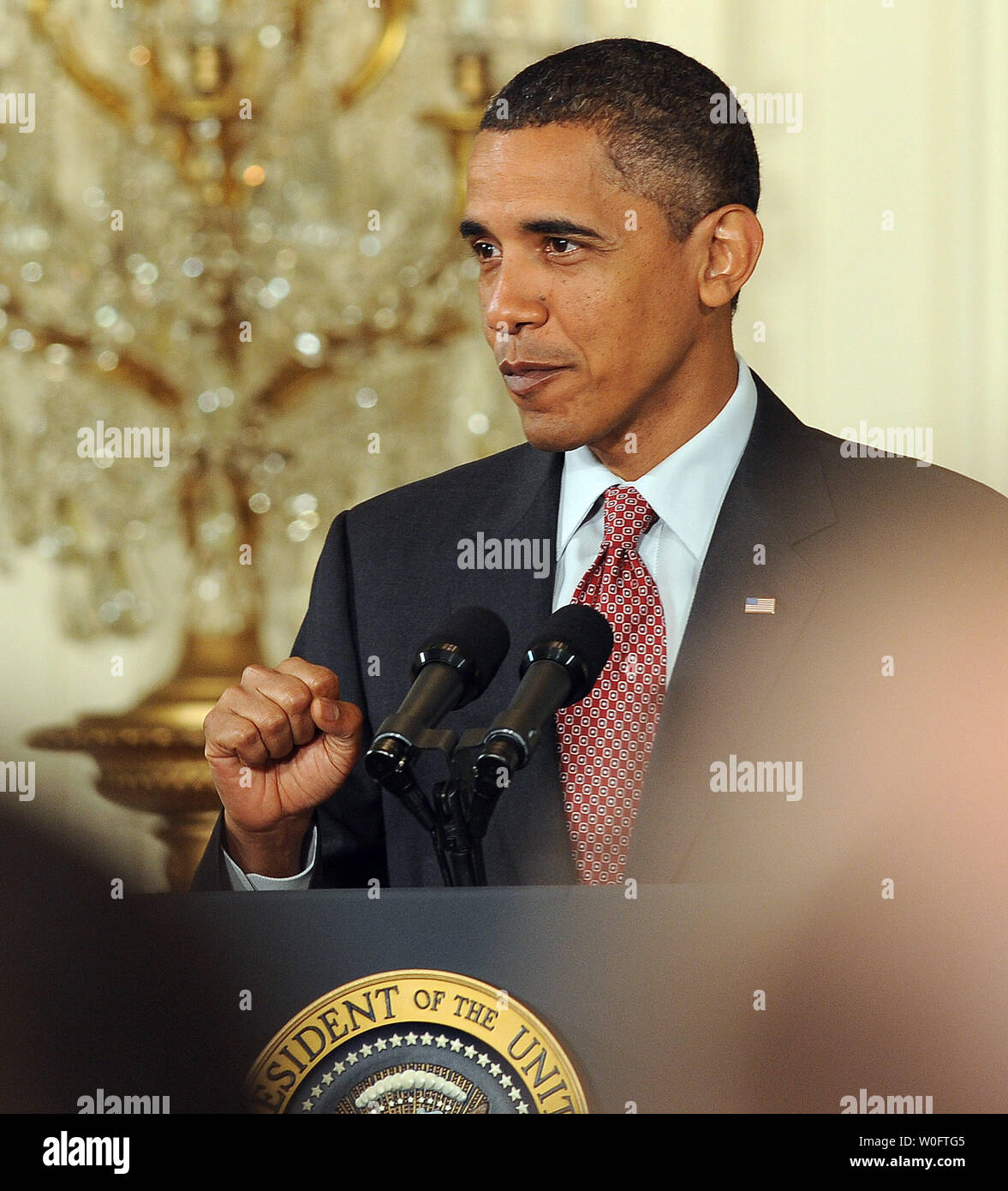 U.S. President Barack Obama jokes about catching a fly that was flying ...