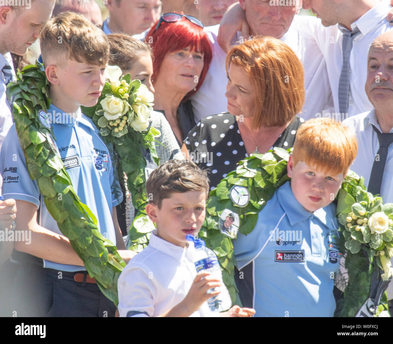 The remains of the late rally driver Manus "Mandy" Kelly are carried ...