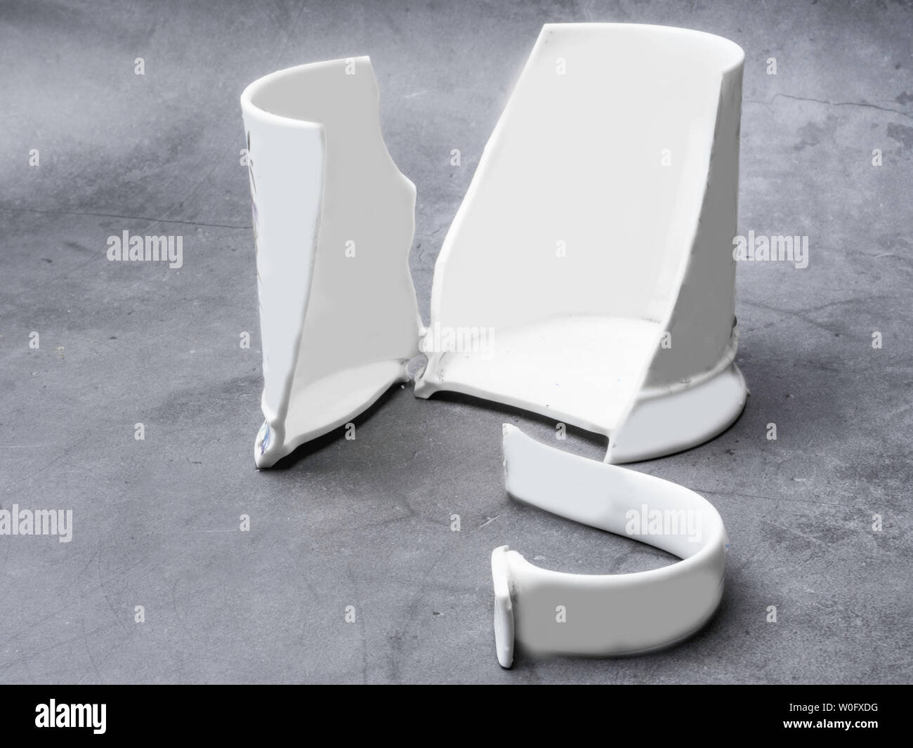 Broken white cup pieces Stock Photo - Alamy