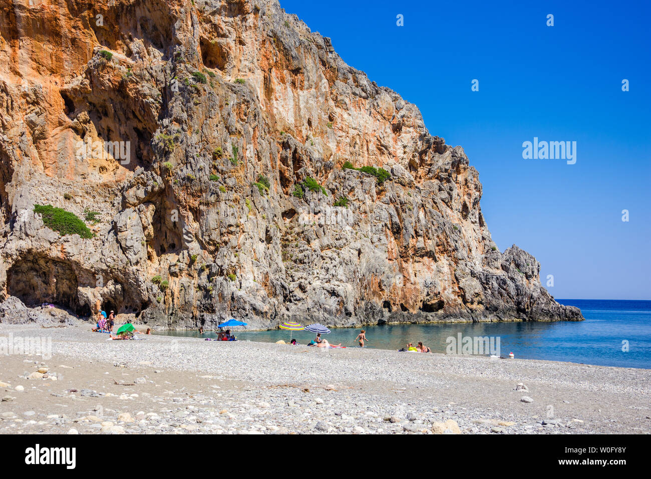 Agiofarago beach with natural caves and stone arches at the end of the ...