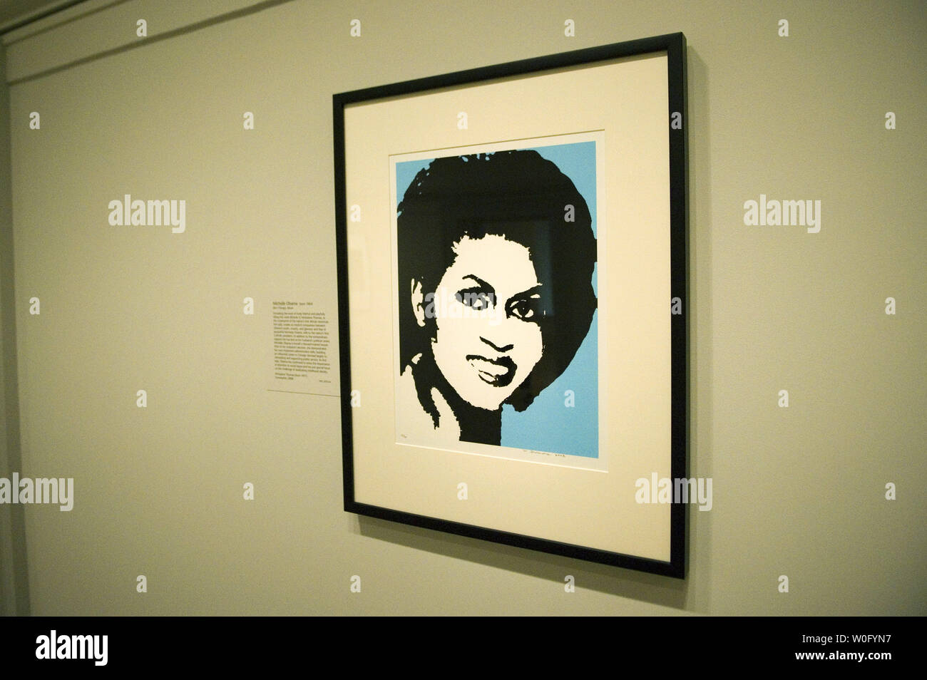 A screenprint of first lady Michelle Obama by Mickalene Thomas is seen ...