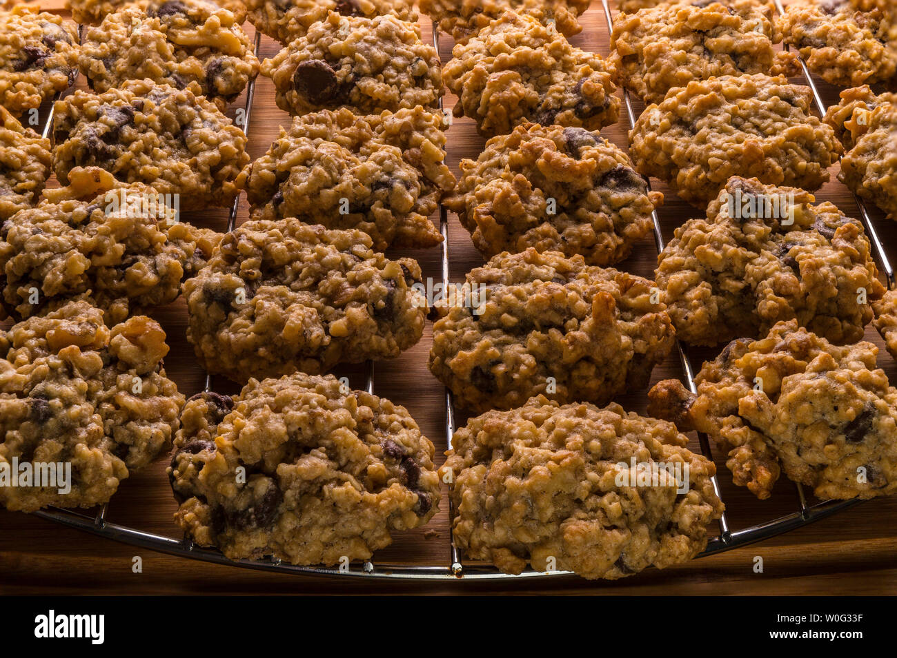 chocolate chip cookies cooling on wire rack Stock Photo - Alamy