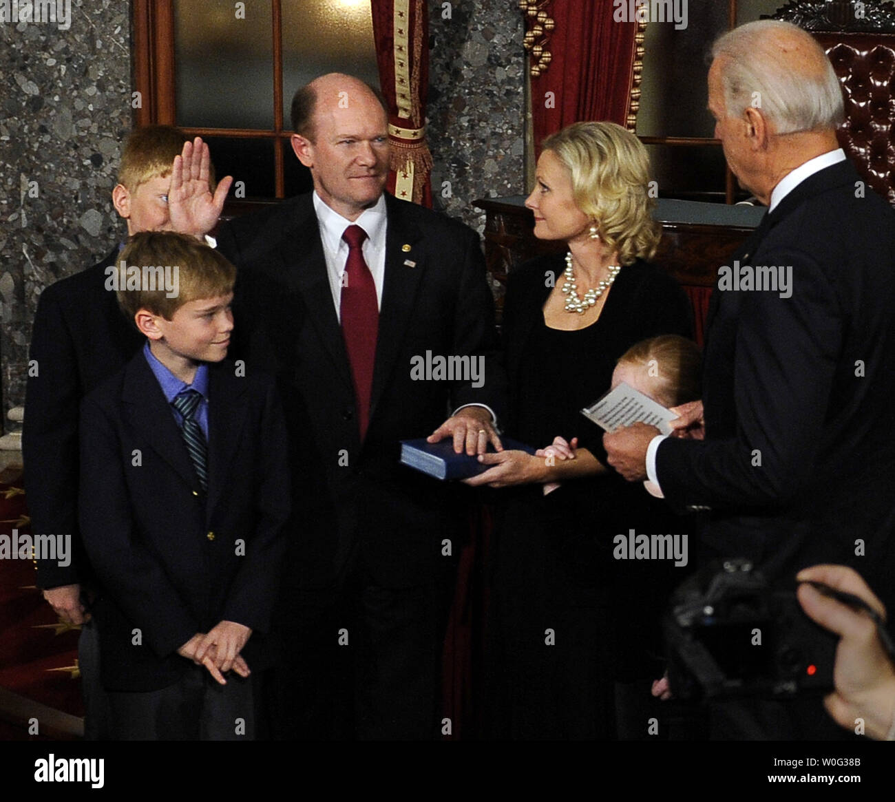 Sen. Chris Coons, D-DE, participates in a ceremonial swearing-in as ...