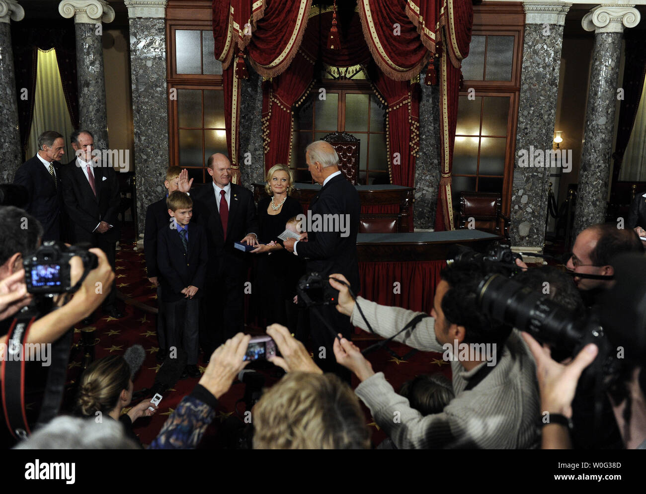 Sen. Chris Coons, D-DE, participates in a ceremonial swearing-in as ...