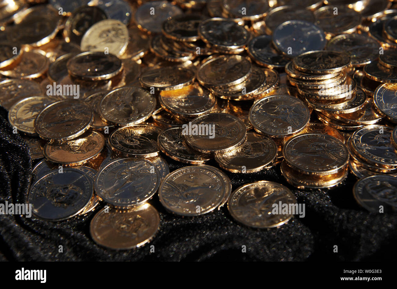 Abraham Lincoln Presidential One Dollar Coins are seen on a table ...
