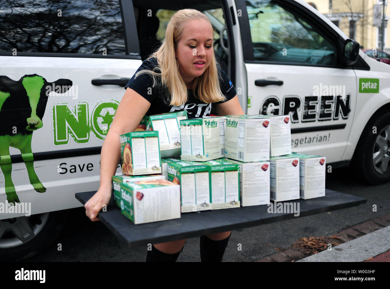 A PETA activist unloads a van of Tofurky prior to a PETA event where ...