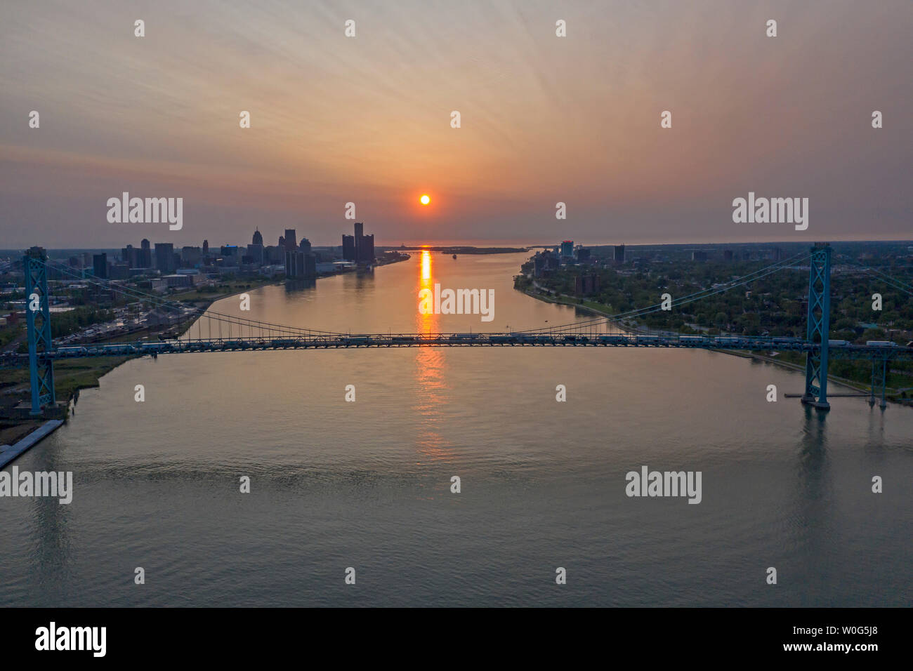 Detroit, Michigan - Sunrise over the Detroit River. The Ambassador ...
