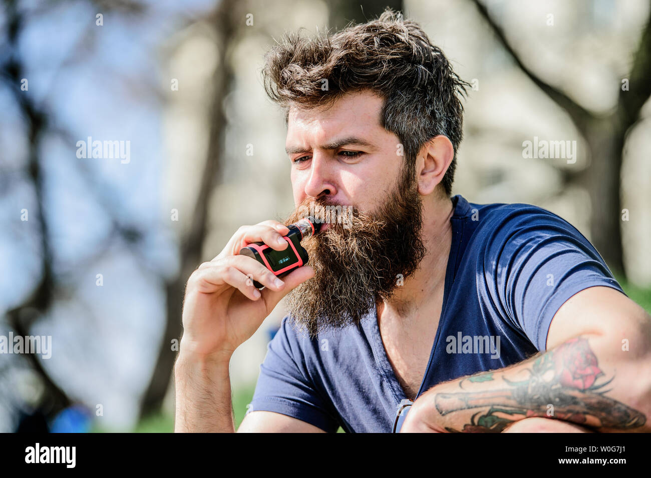 Health safety and addiction. inhaling vapor. Bearded brutal male ...