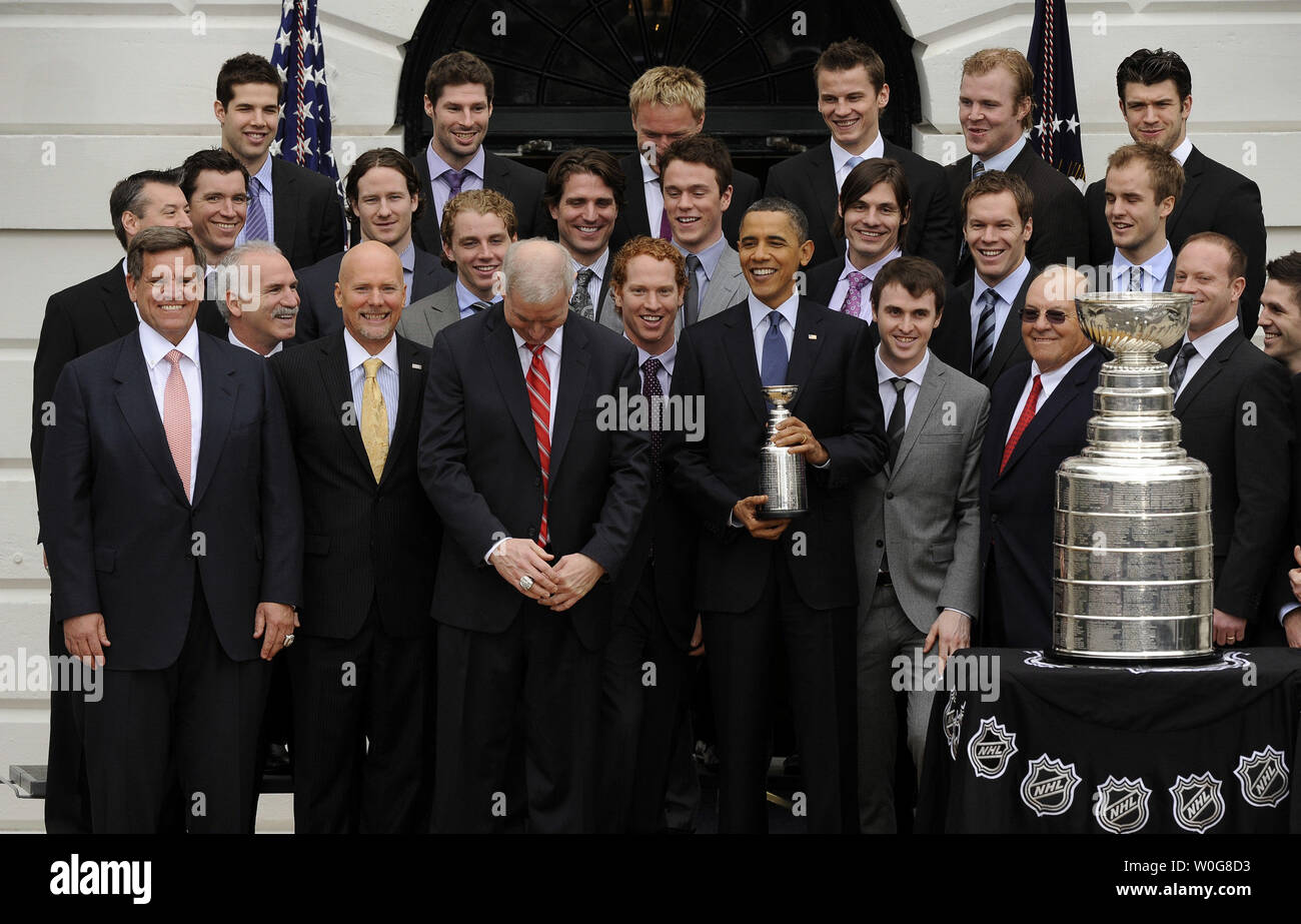 U.S. President Barack Obama holds a miniature Stanley Cup as he hosts ...