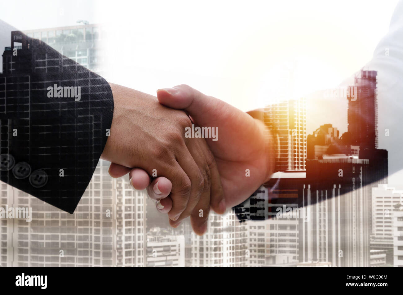 Partnership. double exposure image of investor business man handshake ...