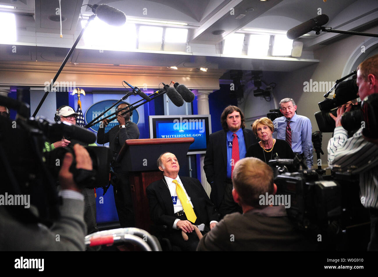 Former White House press secretary James Brady (C), who was paralyzed ...