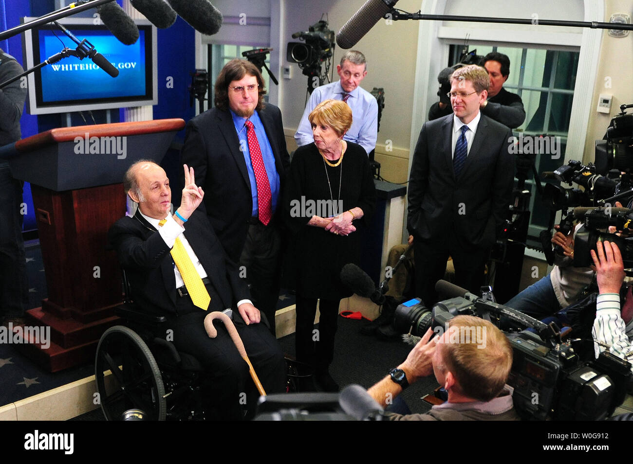 Former White House press secretary James Brady (C), who was paralyzed ...