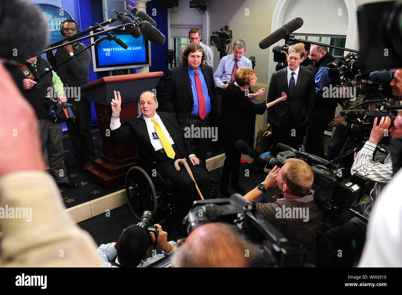 Former White House press secretary James Brady (C), who was paralyzed ...