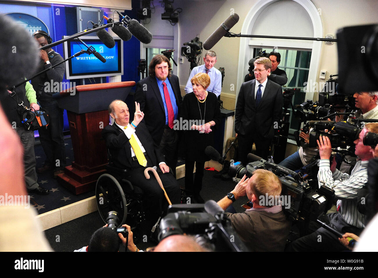Former White House press secretary James Brady (C), who was paralyzed ...
