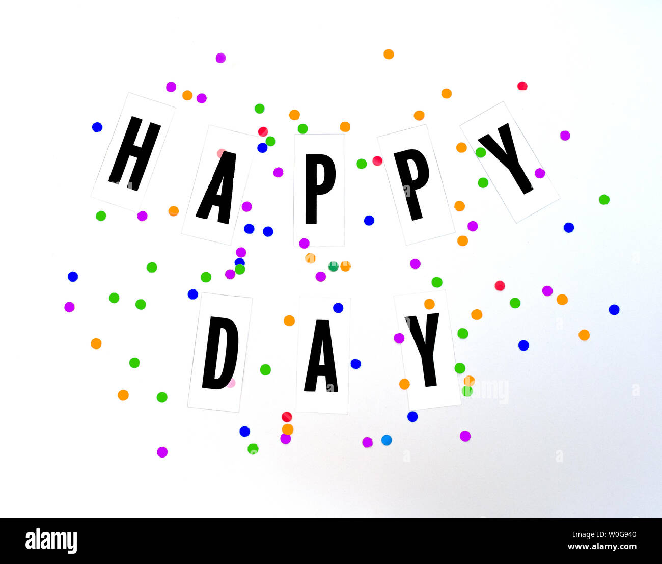 HAPPY DAY word on colorful rainbow confetti background Stock Photo - Alamy