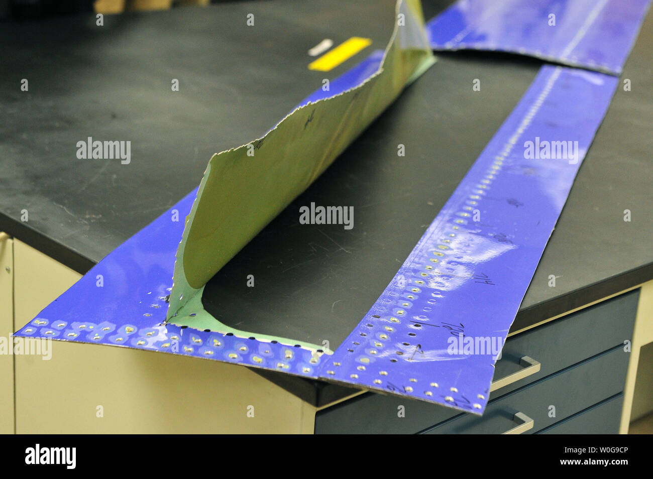 The damage section of fuselage skin from Southwest flight 812 is seen ...