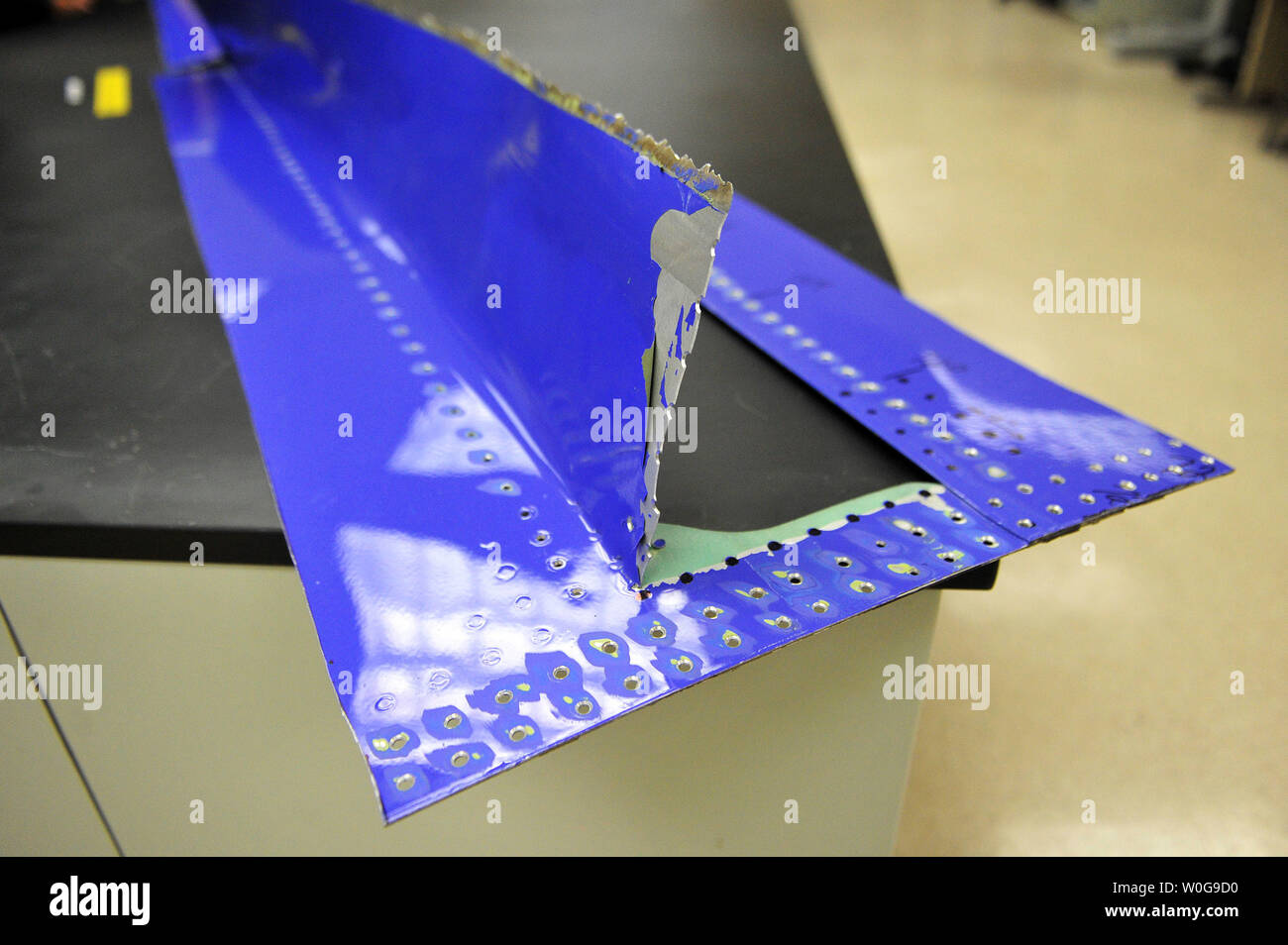 The damage section of fuselage skin from Southwest flight 812 is seen ...