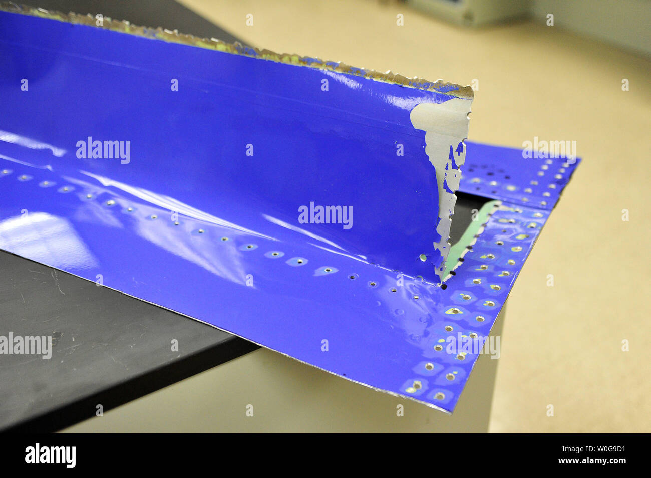 The damage section of fuselage skin from Southwest flight 812 is seen ...
