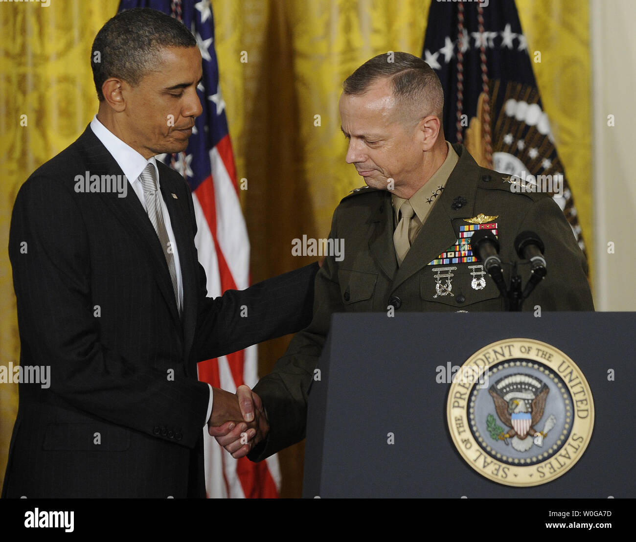 U.S. President Barack Obama shakes hands with Lt. General John Allen ...