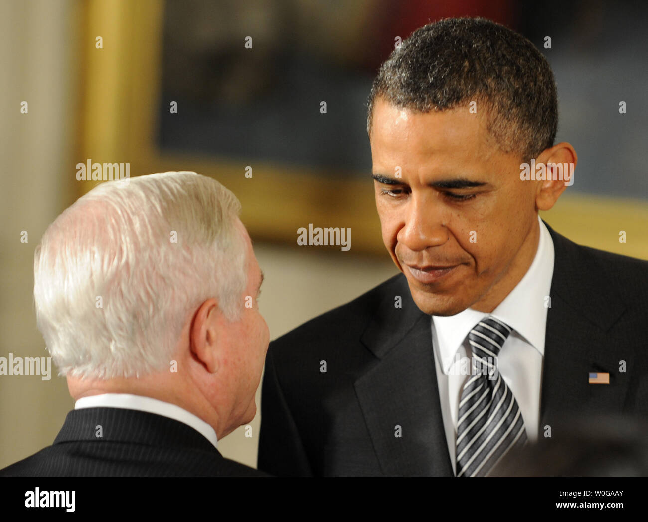U. S. President Barack Obama talk with Secretary of Defense Robert ...
