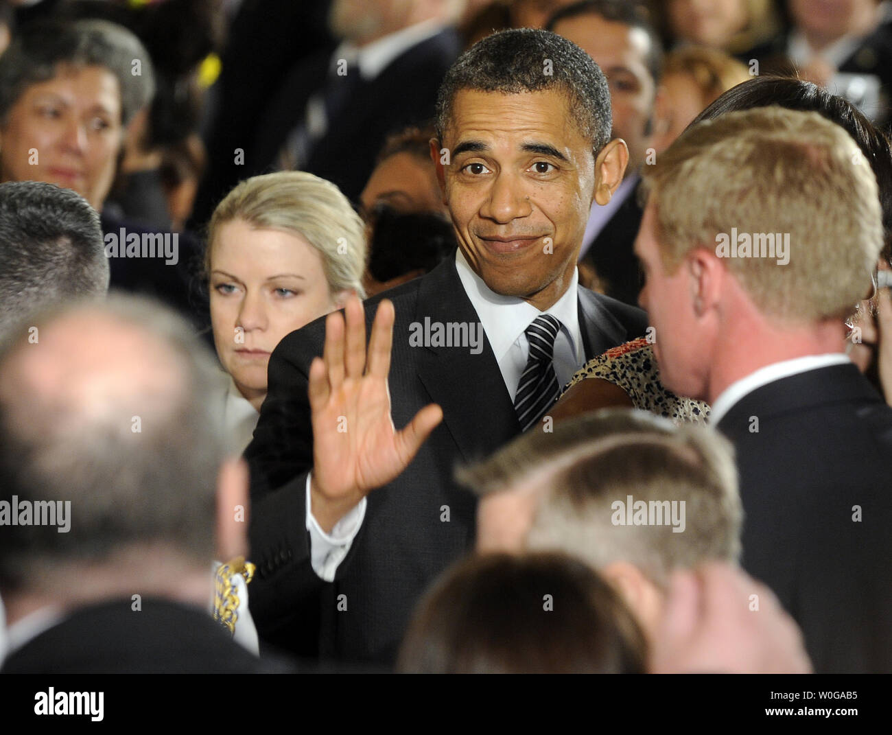 U.S. President Barack Obama greets guests after a ceremony to ...