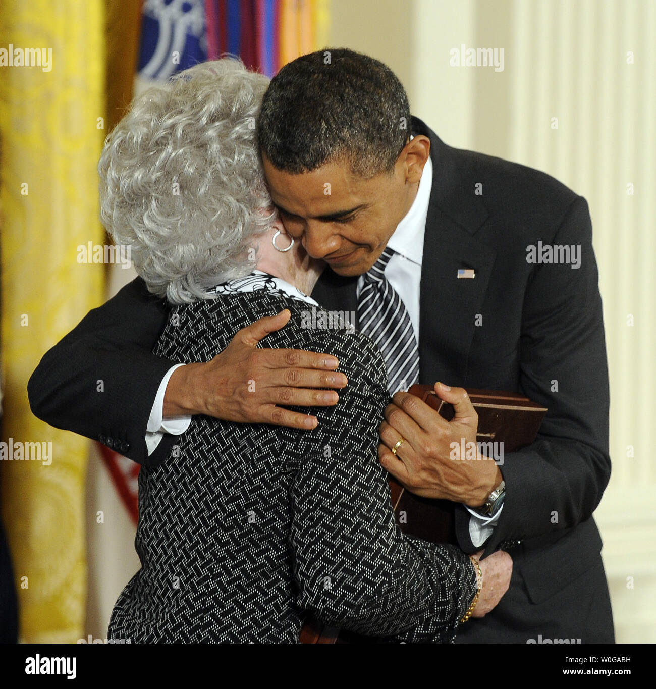 U.S. President Barack Obama presents sister Dorothy Matthews with the ...