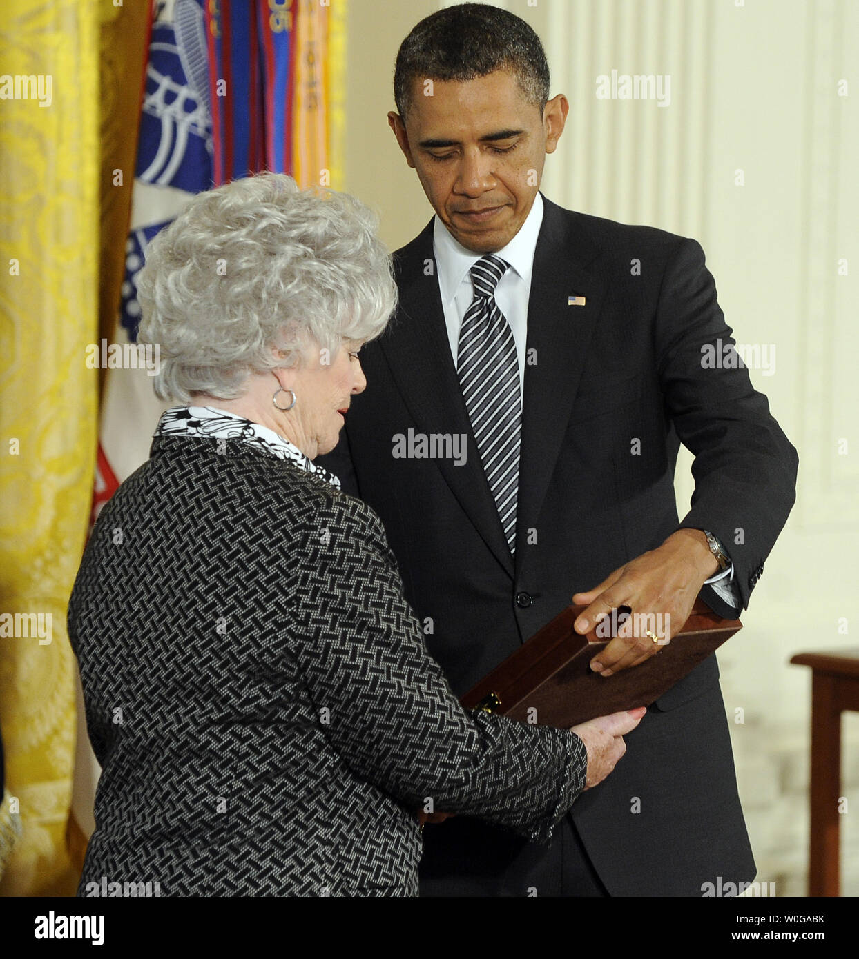 U.S. President Barack Obama presents sister Dorothy Matthews with the ...