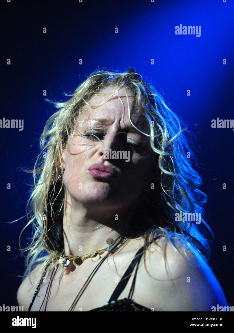 Lead singer Shannon Conley of the rock group Lez Zeppelin brings down ...