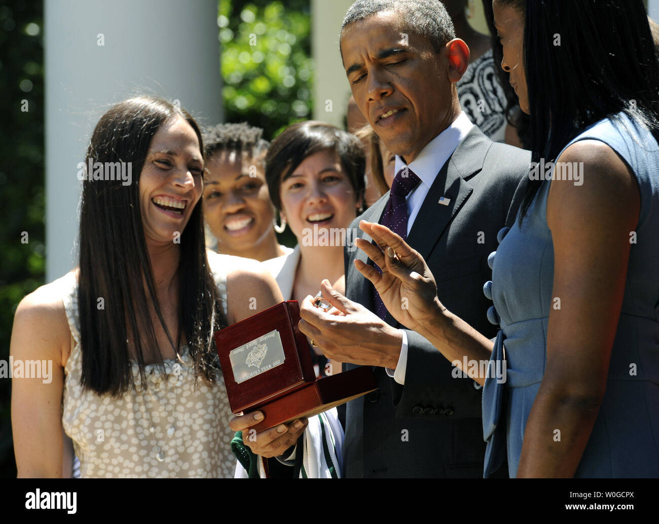 U.S. President Barack Obama looks at a championship ring he was given ...