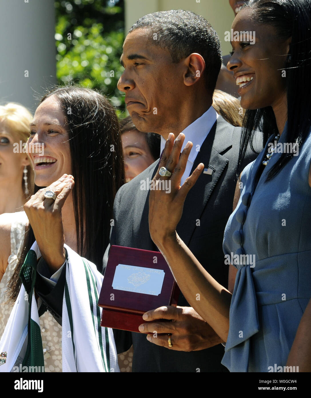 U.S. President Barack Obama shows off a championship ring he was given ...