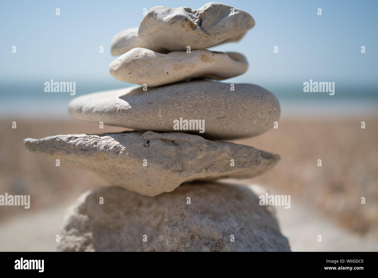 Stone cairn rock pile on the beach by the sea Stock Photo - Alamy