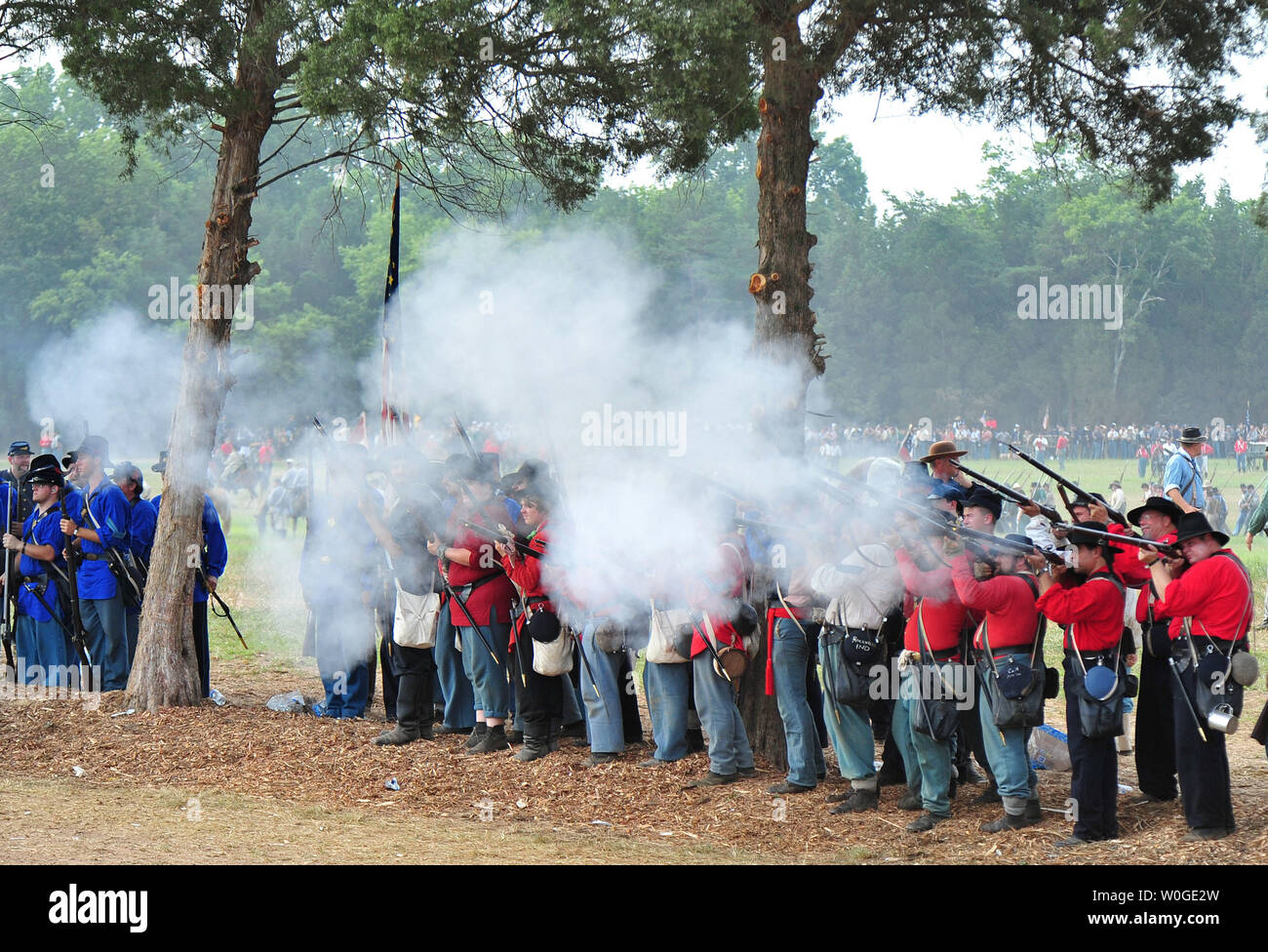 Union soldiers fire during the reenactment of the Battle of Bull Run at ...