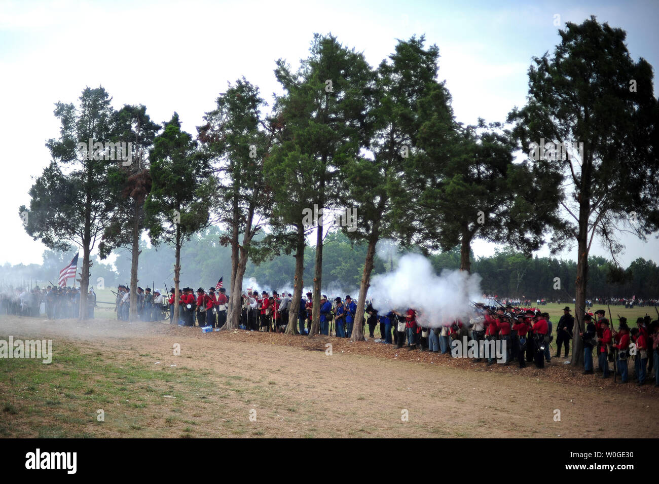 Union soldiers fire during the reenactment of the Battle of Bull Run at ...