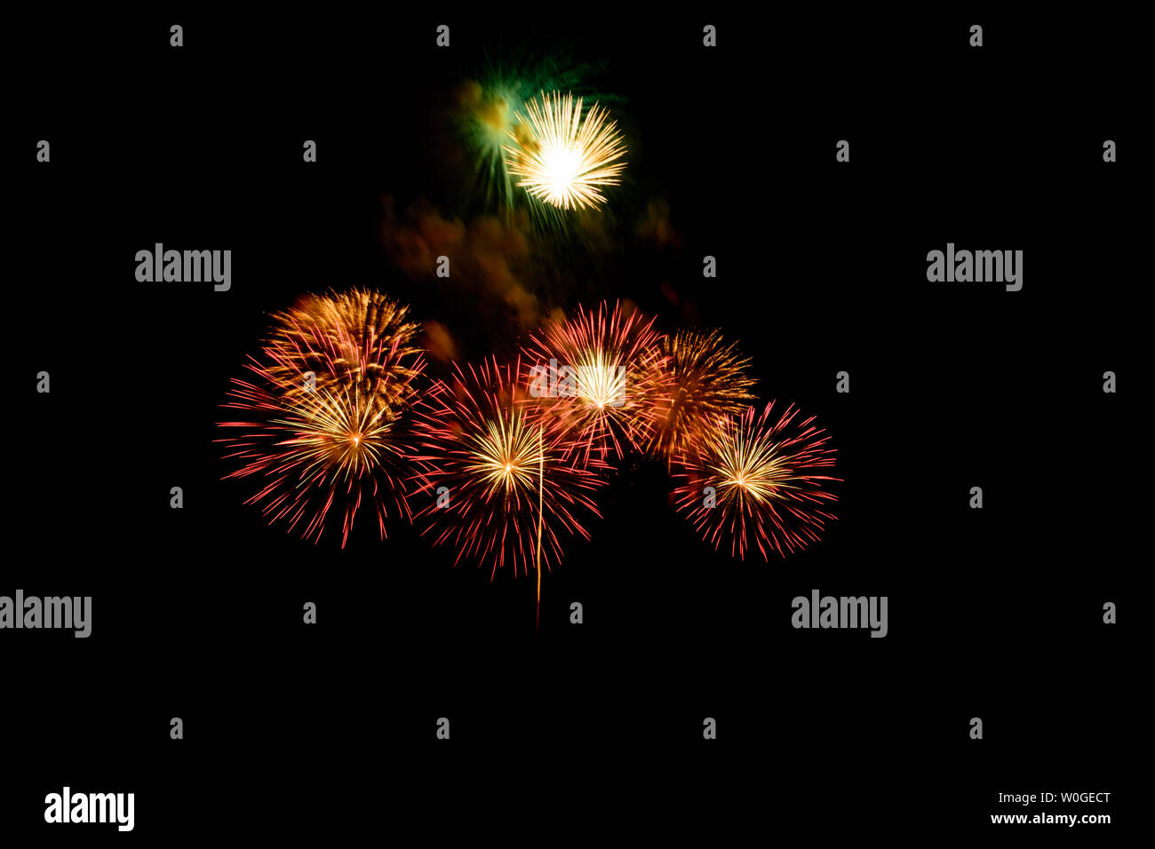 Beautiful colorful fireworks display on the urban lake for celebration ...