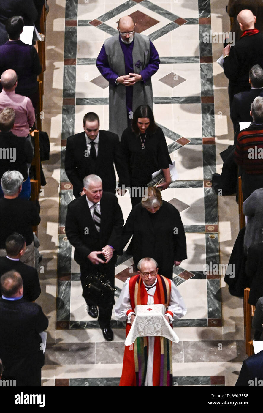 Bishop Gene Robinson carries the remains of Matthew Shepard, followed ...