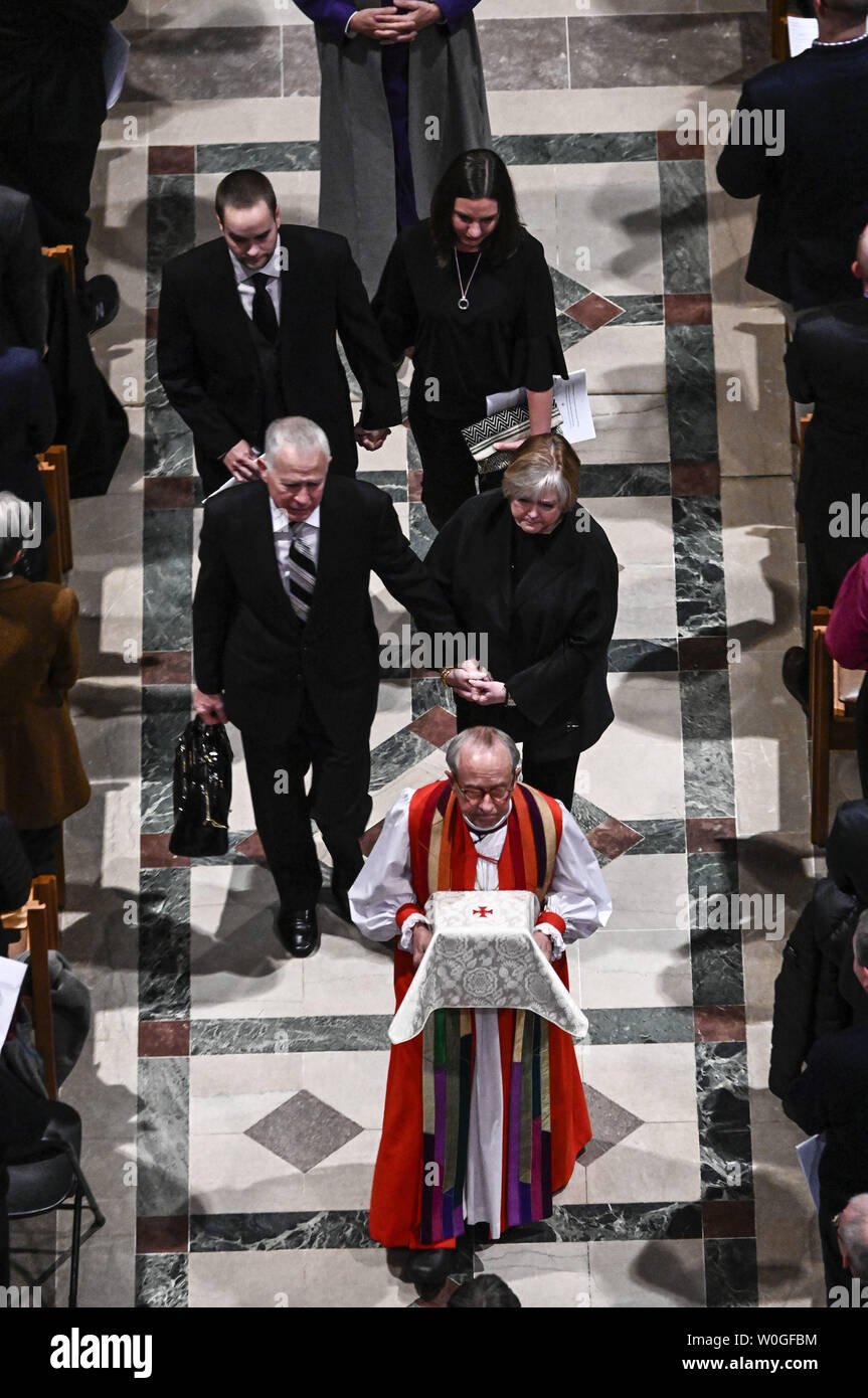 Bishop Gene Robinson carries the remains of Matthew Shepard, followed ...