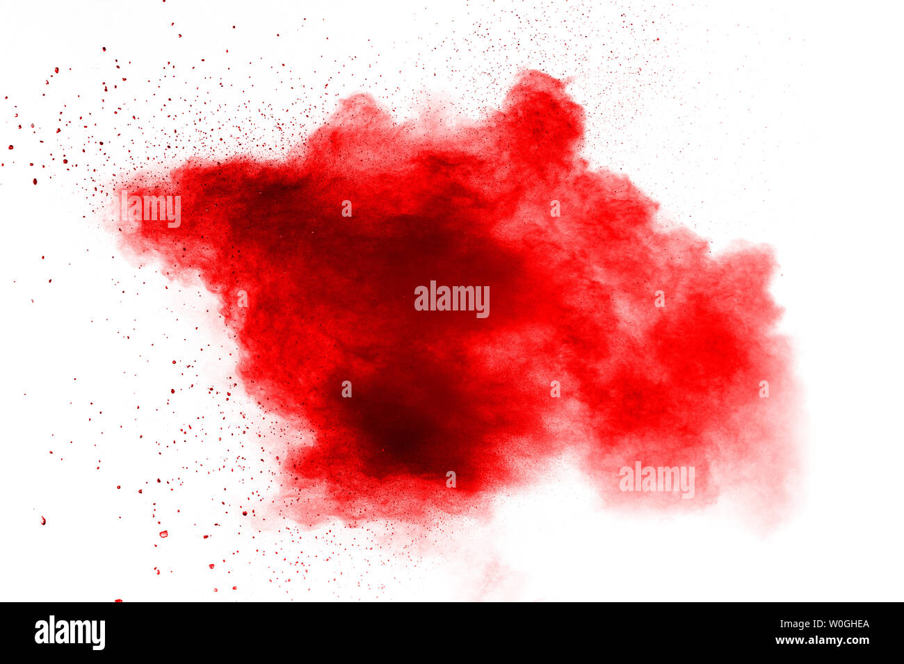 Abstract red dust splattered on white background. Red powder explosion ...