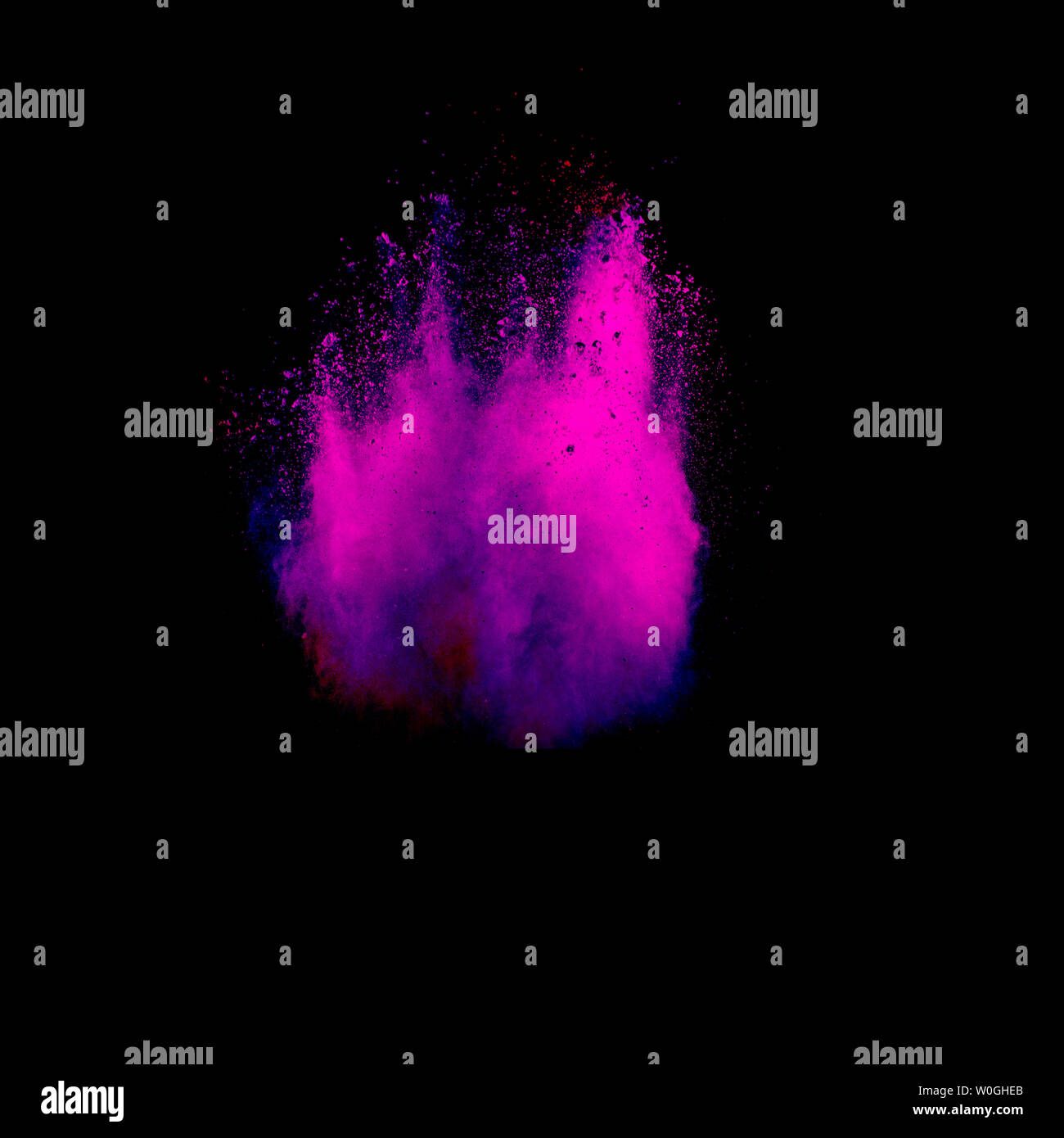 Abstract purple powder explosion on black background. Freeze motion of ...