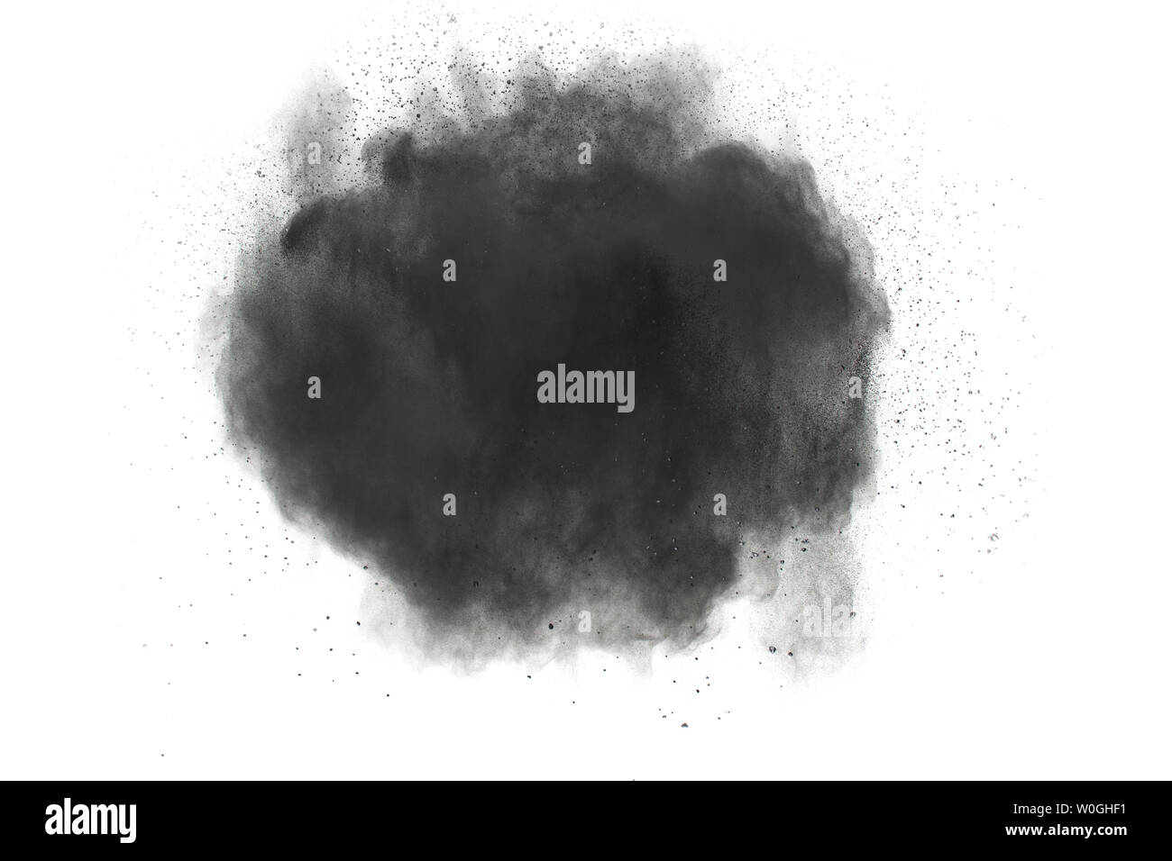Black powder explosion on white background. Black dust particles ...