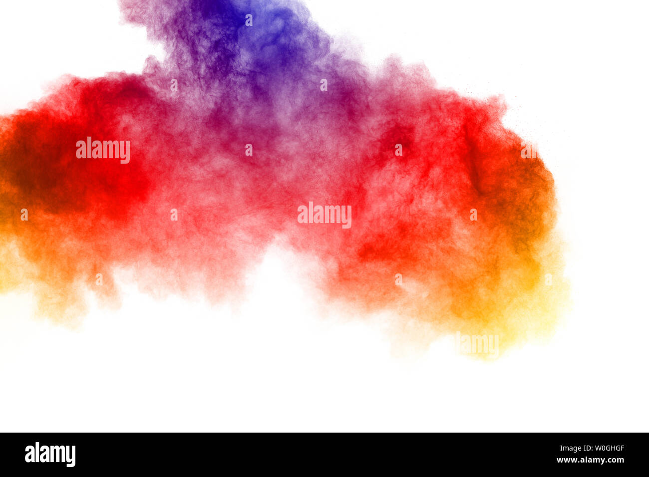 Red yellow blue powder explosion on black background Stock Photo - Alamy